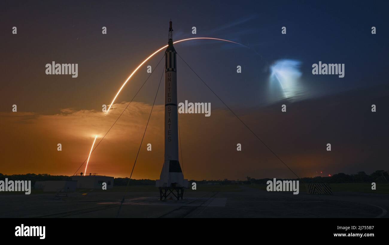 A Mercury Redstone stands silhouetted on Complex 5 as SpaceX launches ...