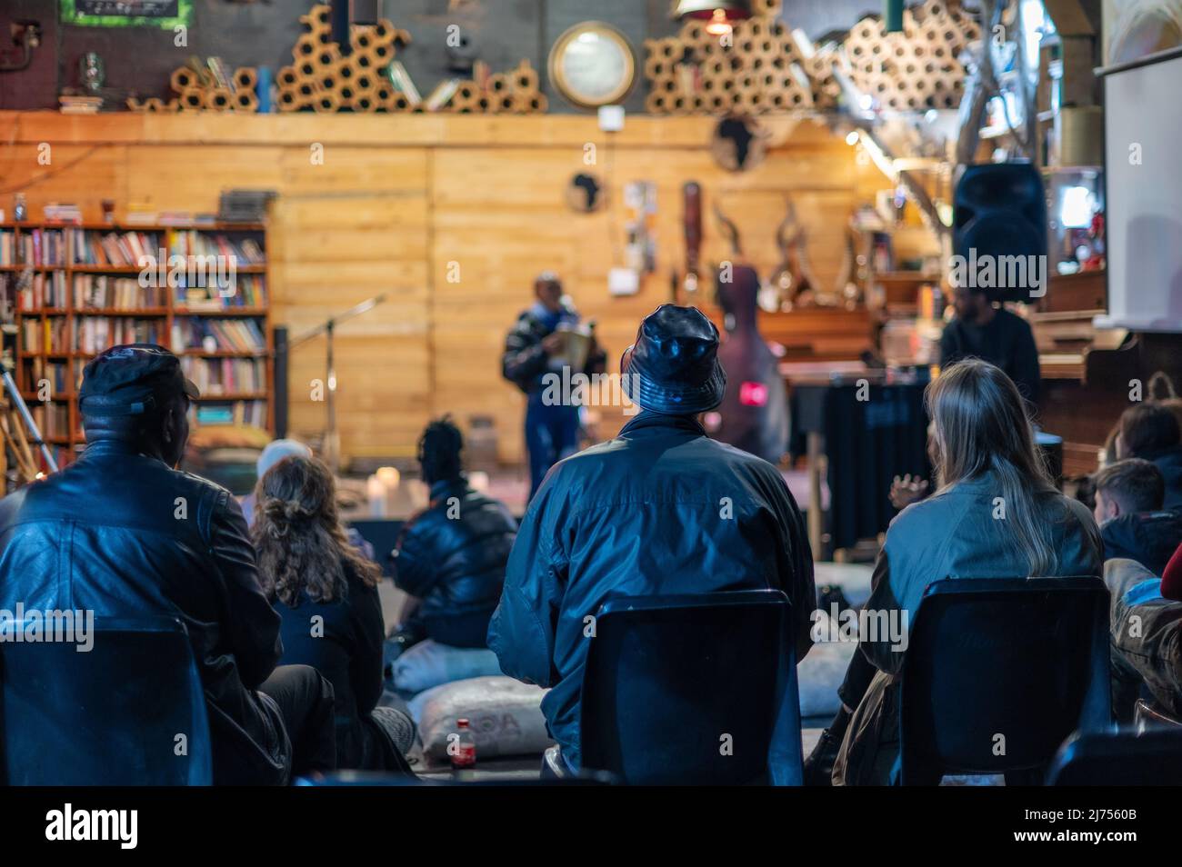 People watching live performance shot from behind Stock Photo - Alamy