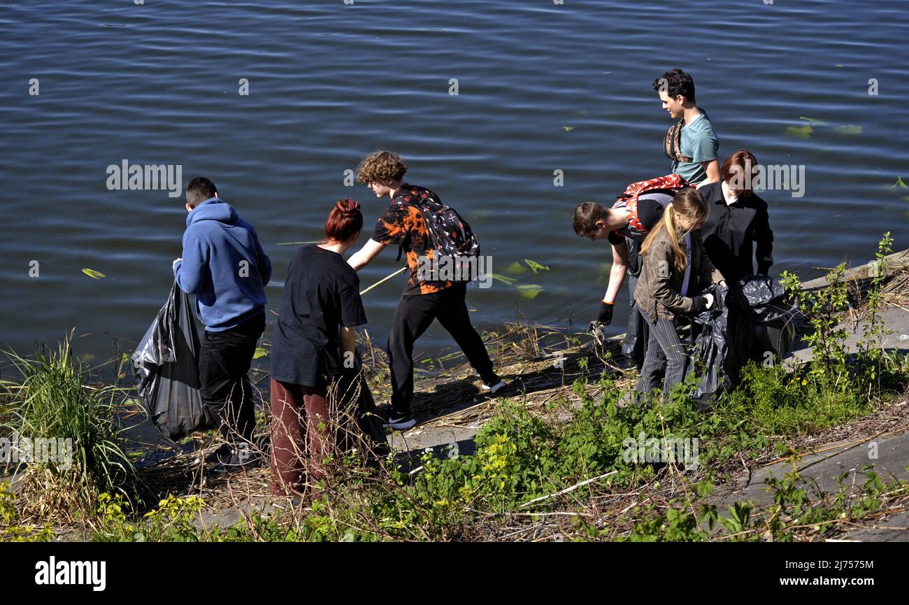 Activists pick up garbage along the embankment of the Pivdennyi Buh ...