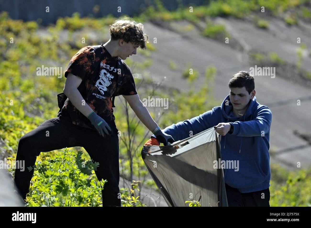Activists pick up garbage along the embankment of the Pivdennyi Buh ...