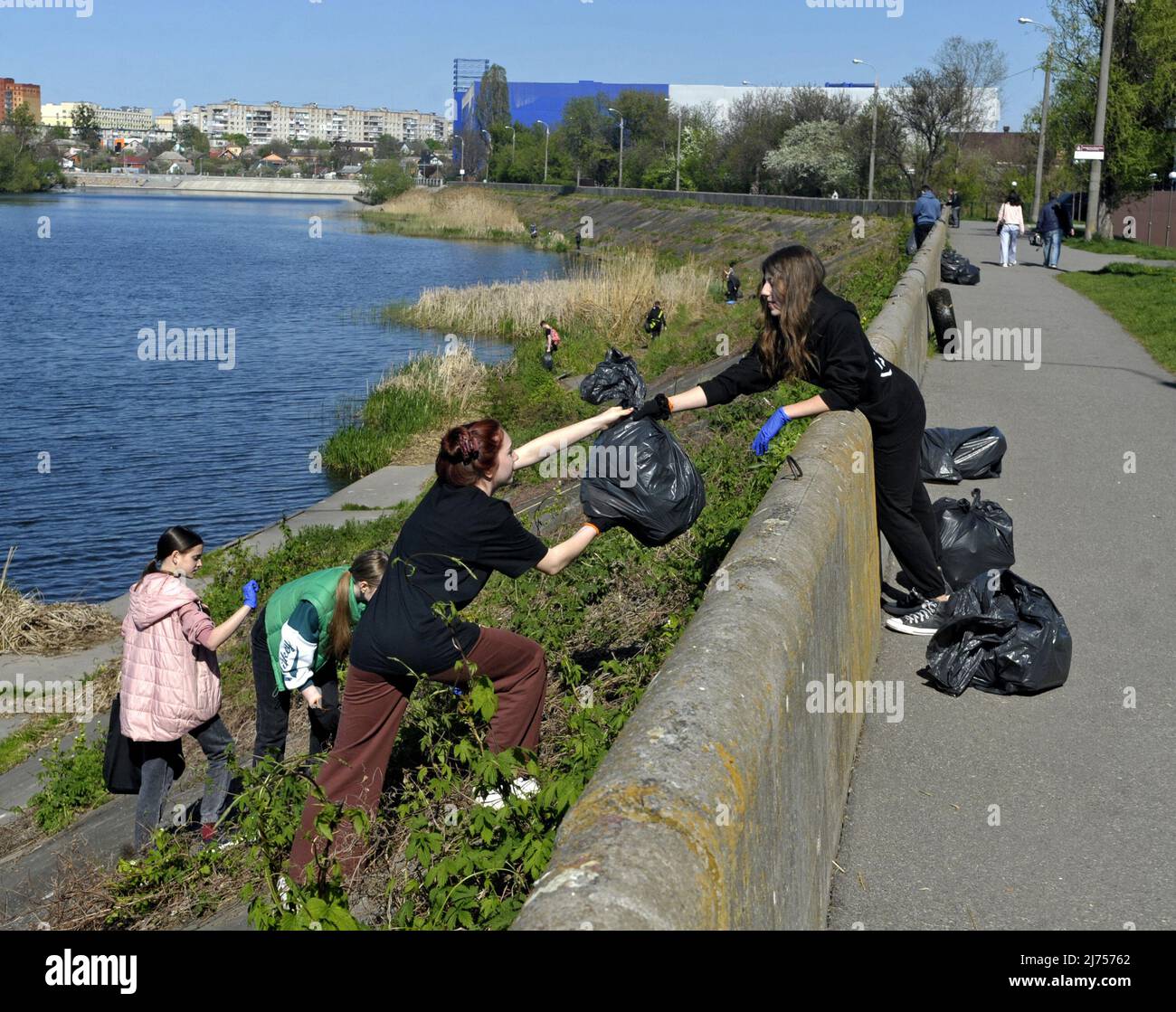 Activists pick up garbage along the embankment of the Pivdennyi Buh ...