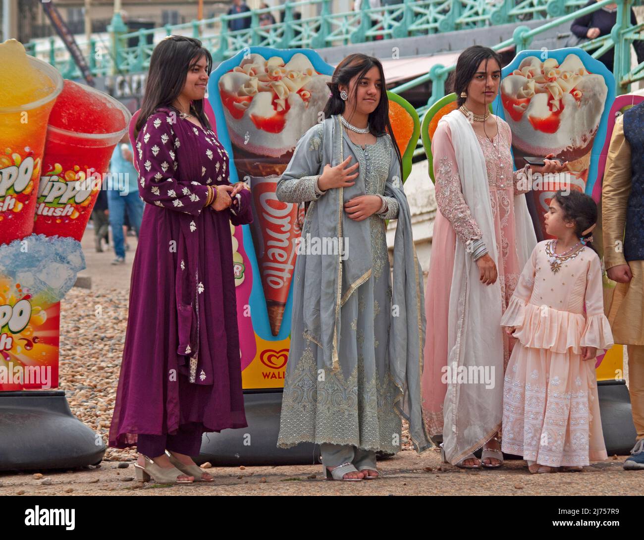 Asian visitors to Brighton wearing pretty dresses Stock Photo - Alamy