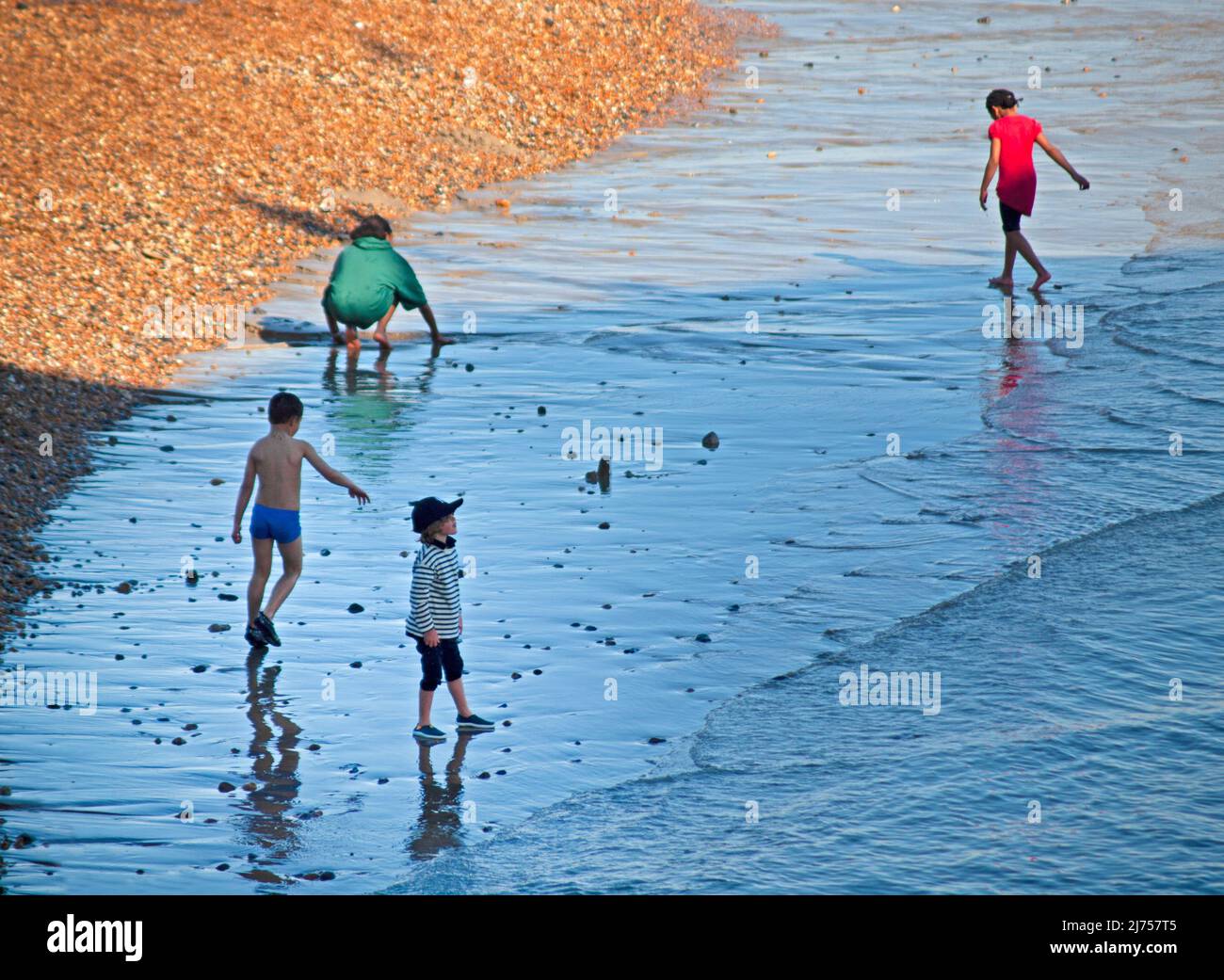 Children paddling in the sea hi-res stock photography and images - Alamy