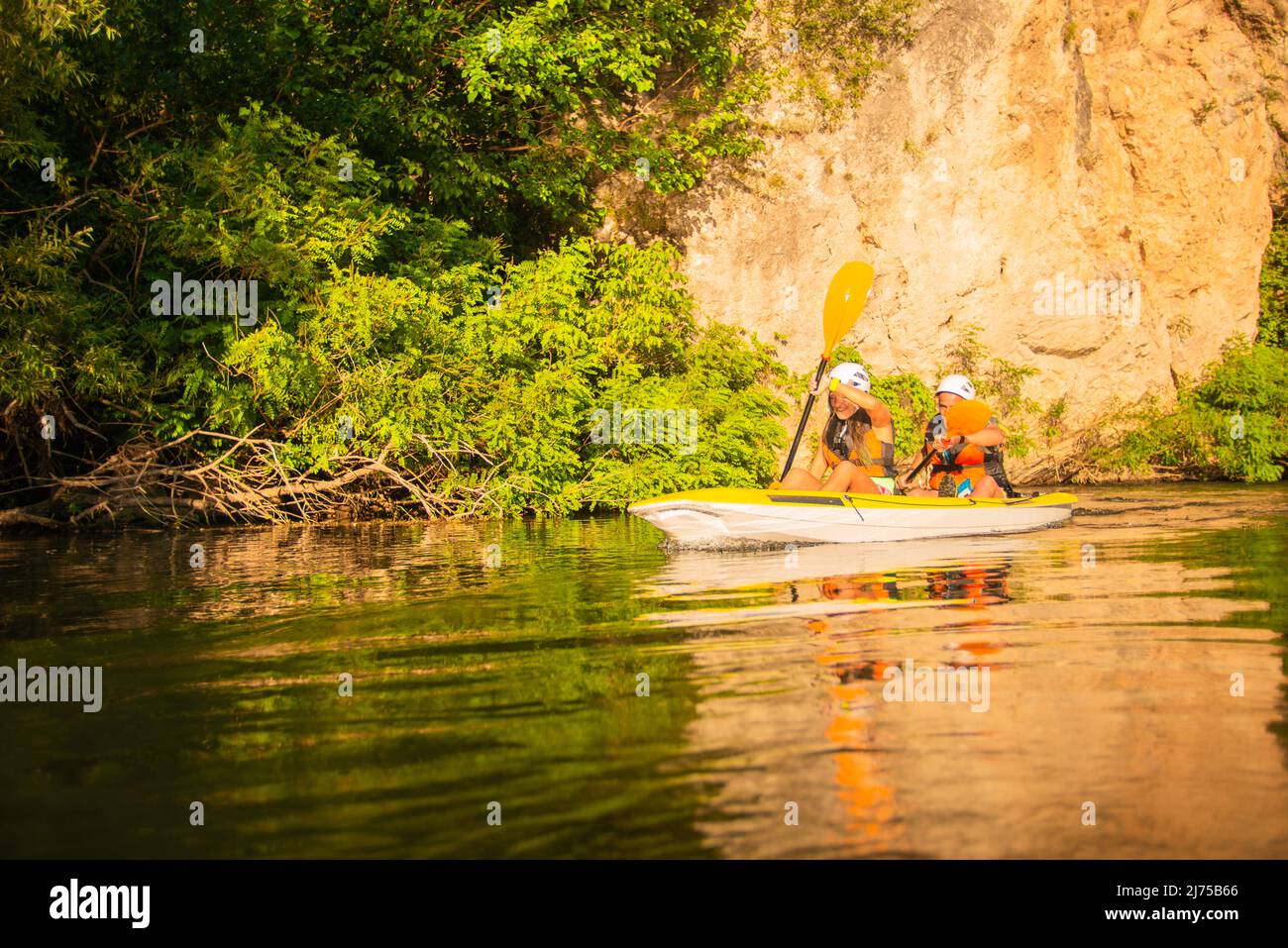 Couple is kayaking together while going towards the kayakers gathering ...