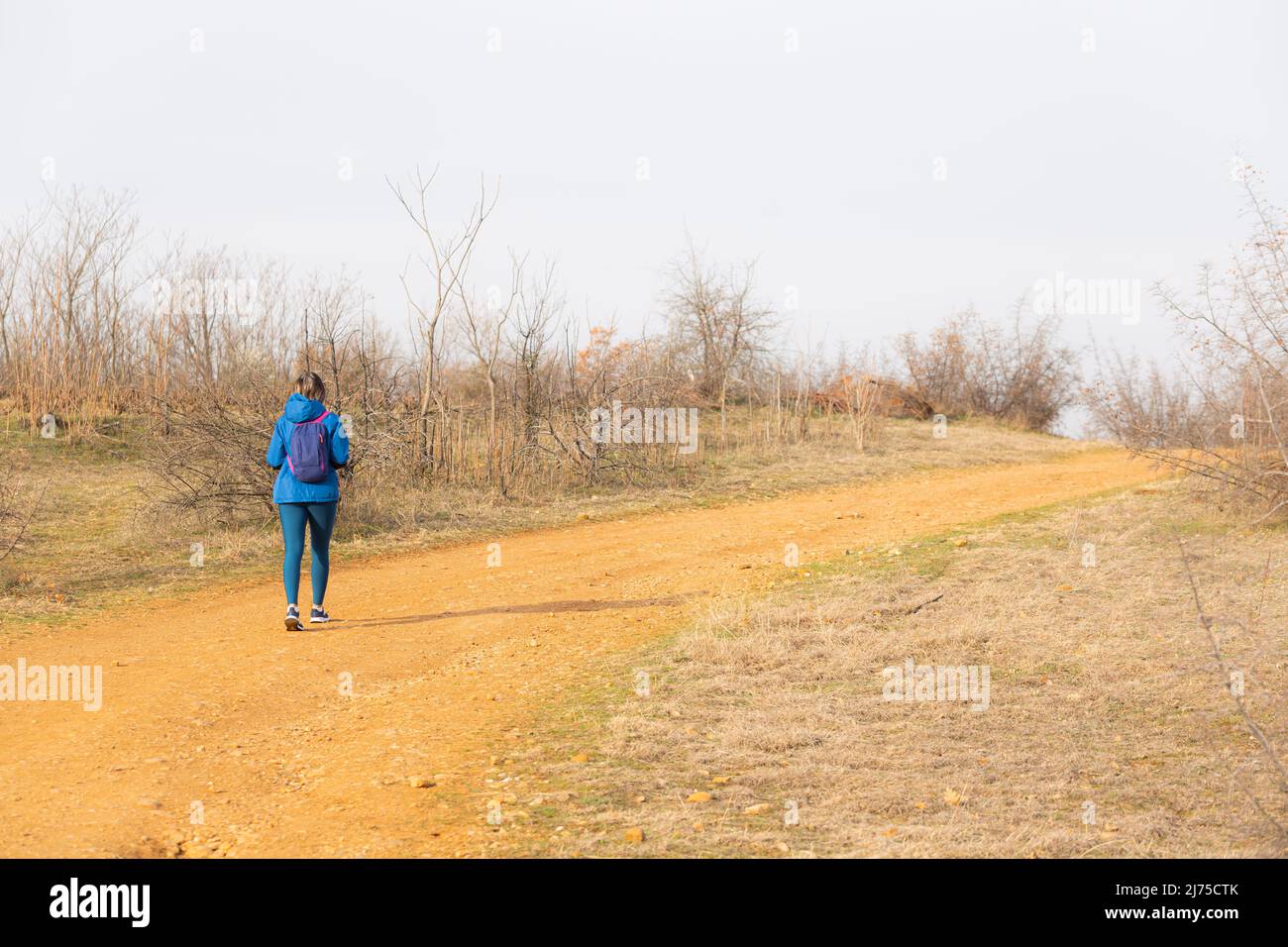 Amazing and active woman is walking alone Stock Photo - Alamy