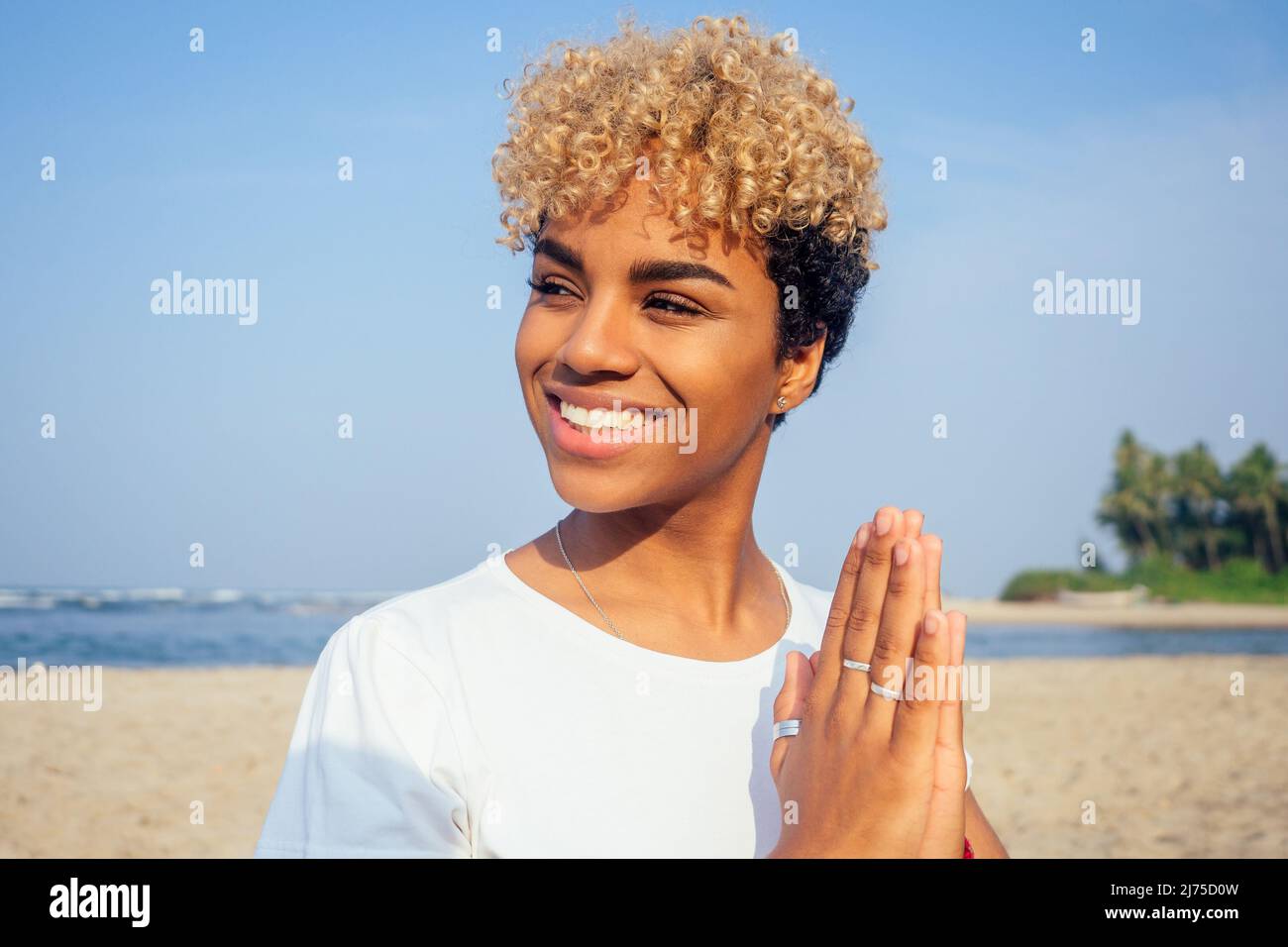 Portrait Of A Young Latin African Woman Sitting In Yoga Pose At The