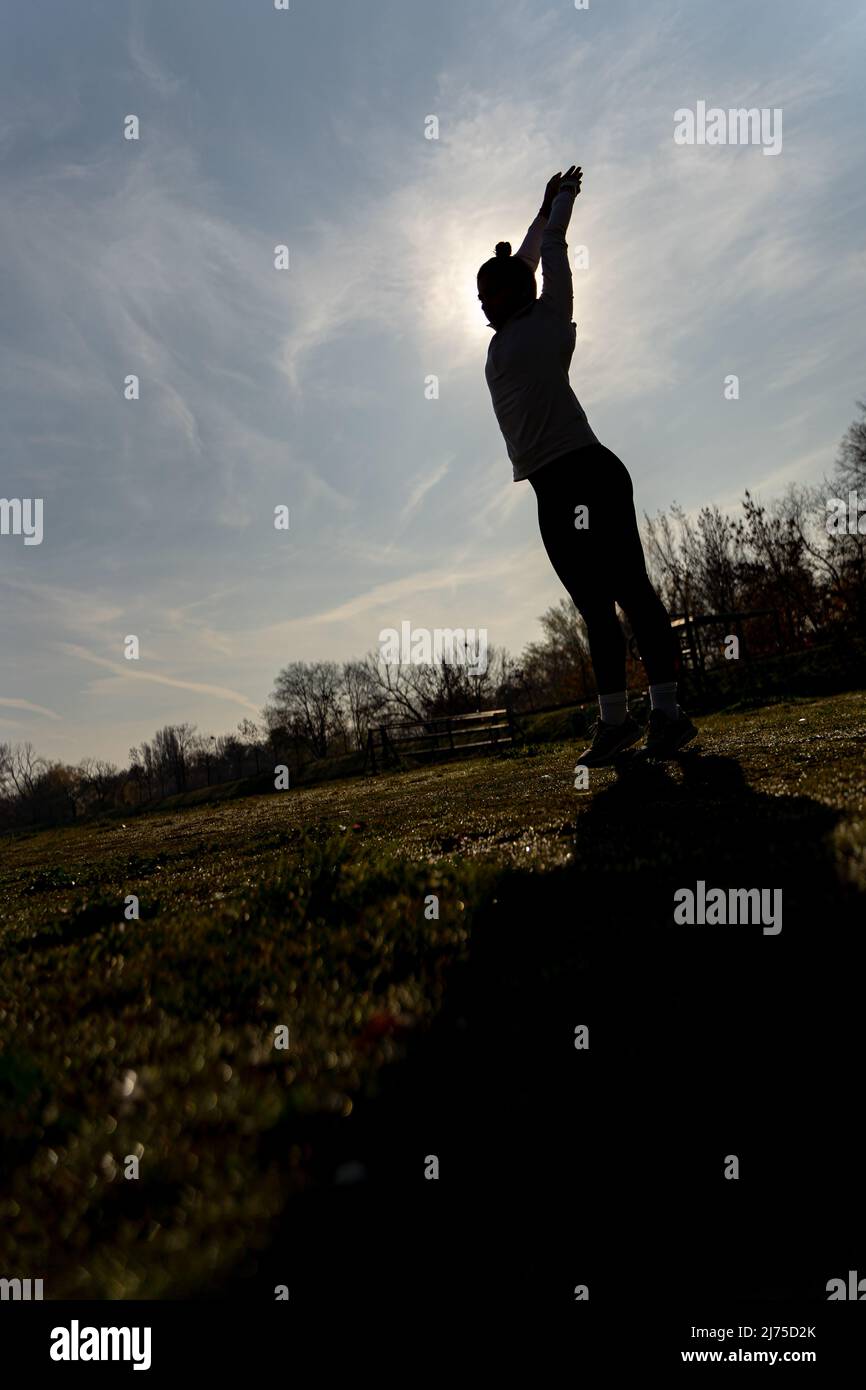 Amazing and attractive girl is stretching alone, silhouette Stock Photo ...