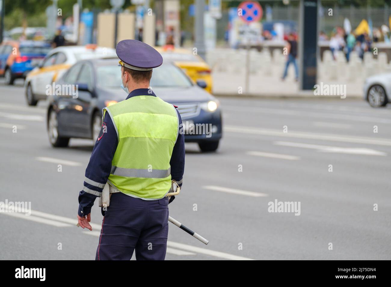 Traffic officer standing near road Stock Photo - Alamy