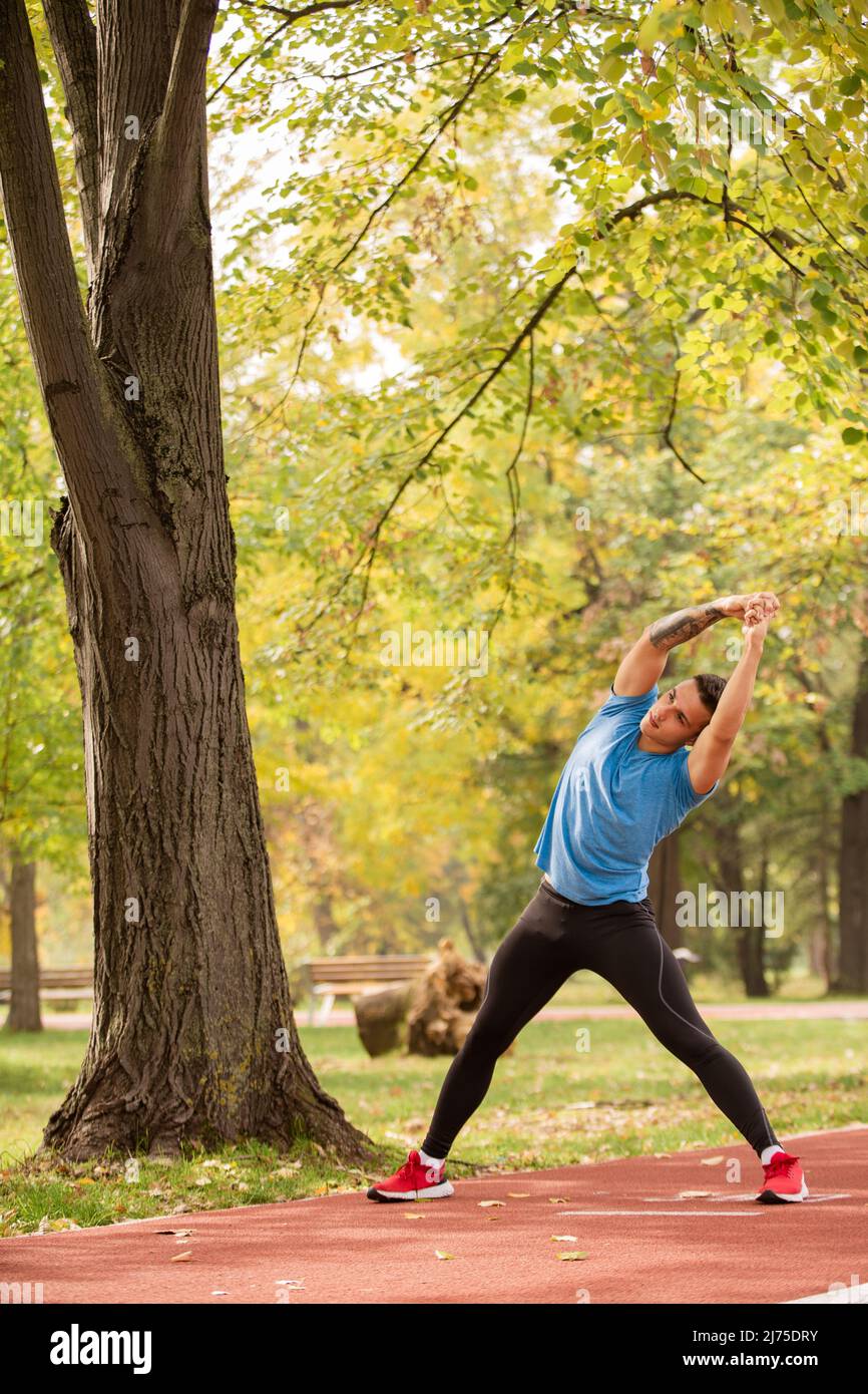Man stretching by the riverside hi-res stock photography and images - Alamy