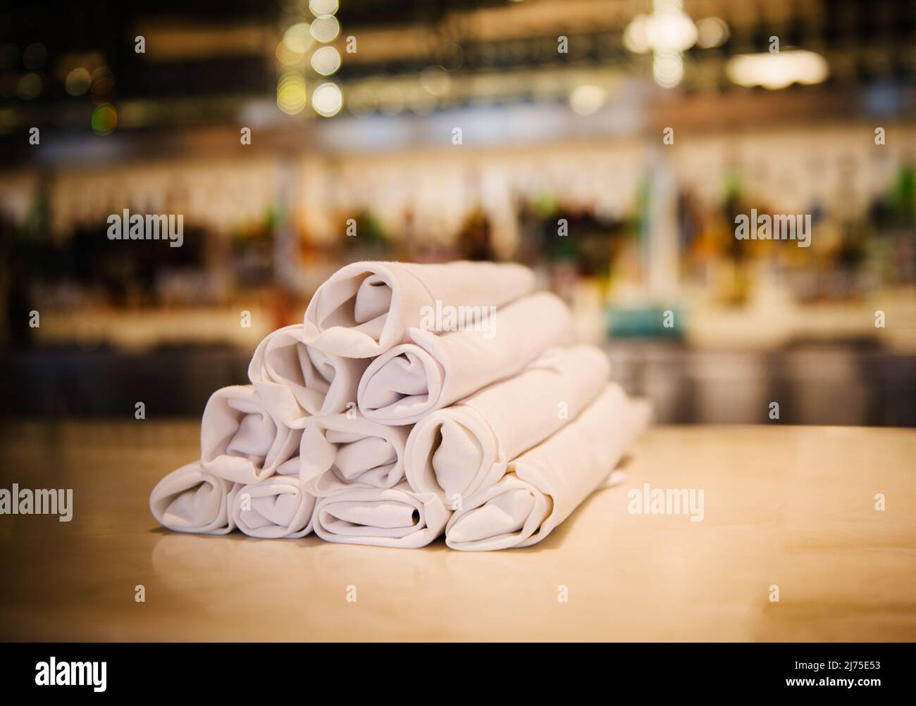 Folded napkins in a restaurant setting Stock Photo - Alamy