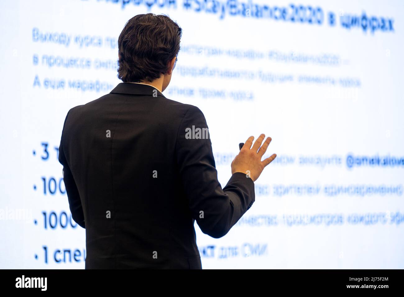 Businessman conducting presentation during seminar Stock Photo - Alamy