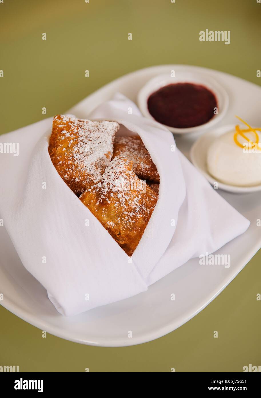 Beignets (deep-fried dough parcels, France Stock Photo - Alamy