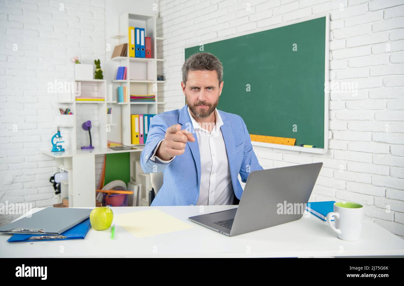 Serious teacher pointing finger in hi-res stock photography and images ...