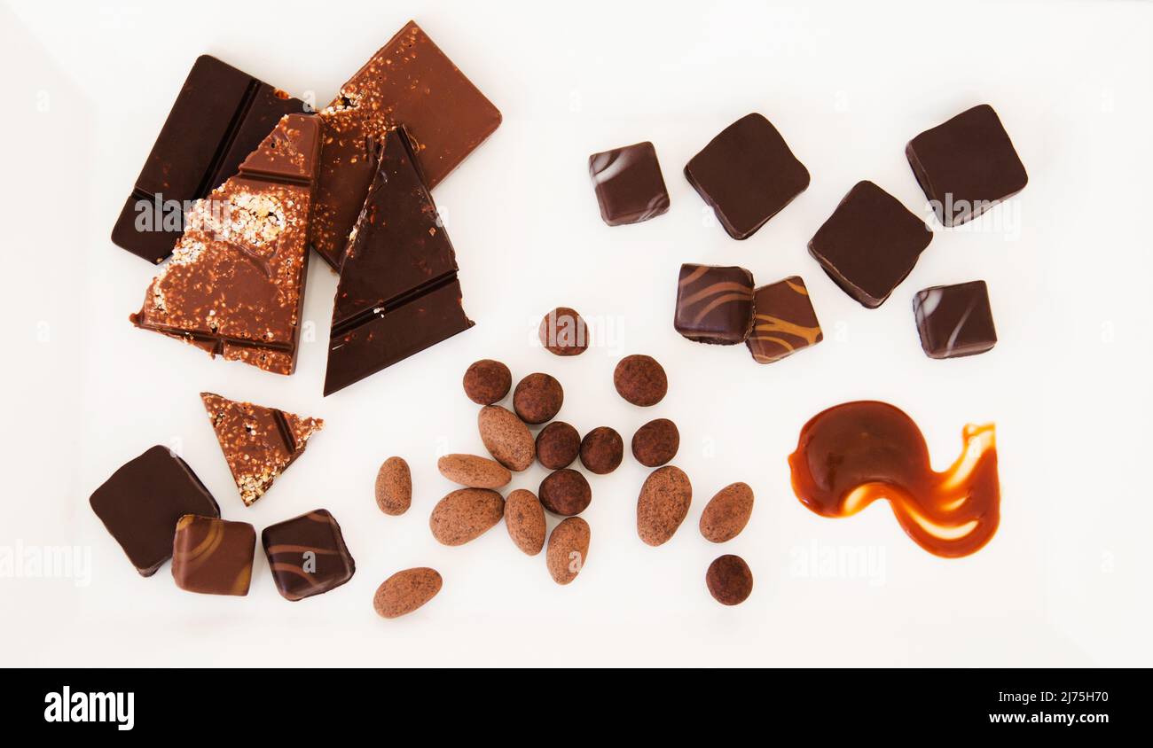 Assorted gourmet chocolates, nuts, and caramels Stock Photo - Alamy