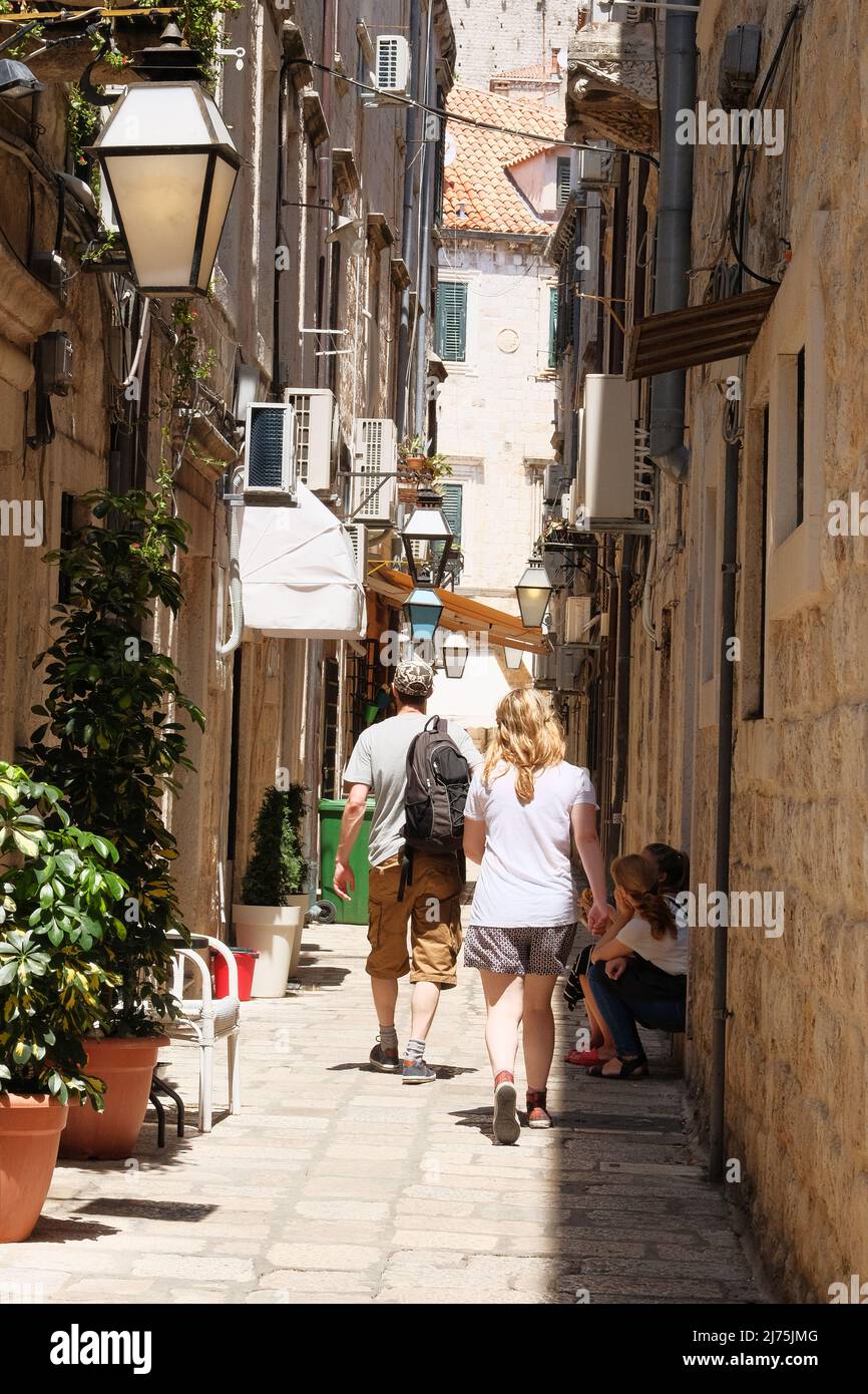 Walk between walls of houses. Passage between walls to the old town and ...