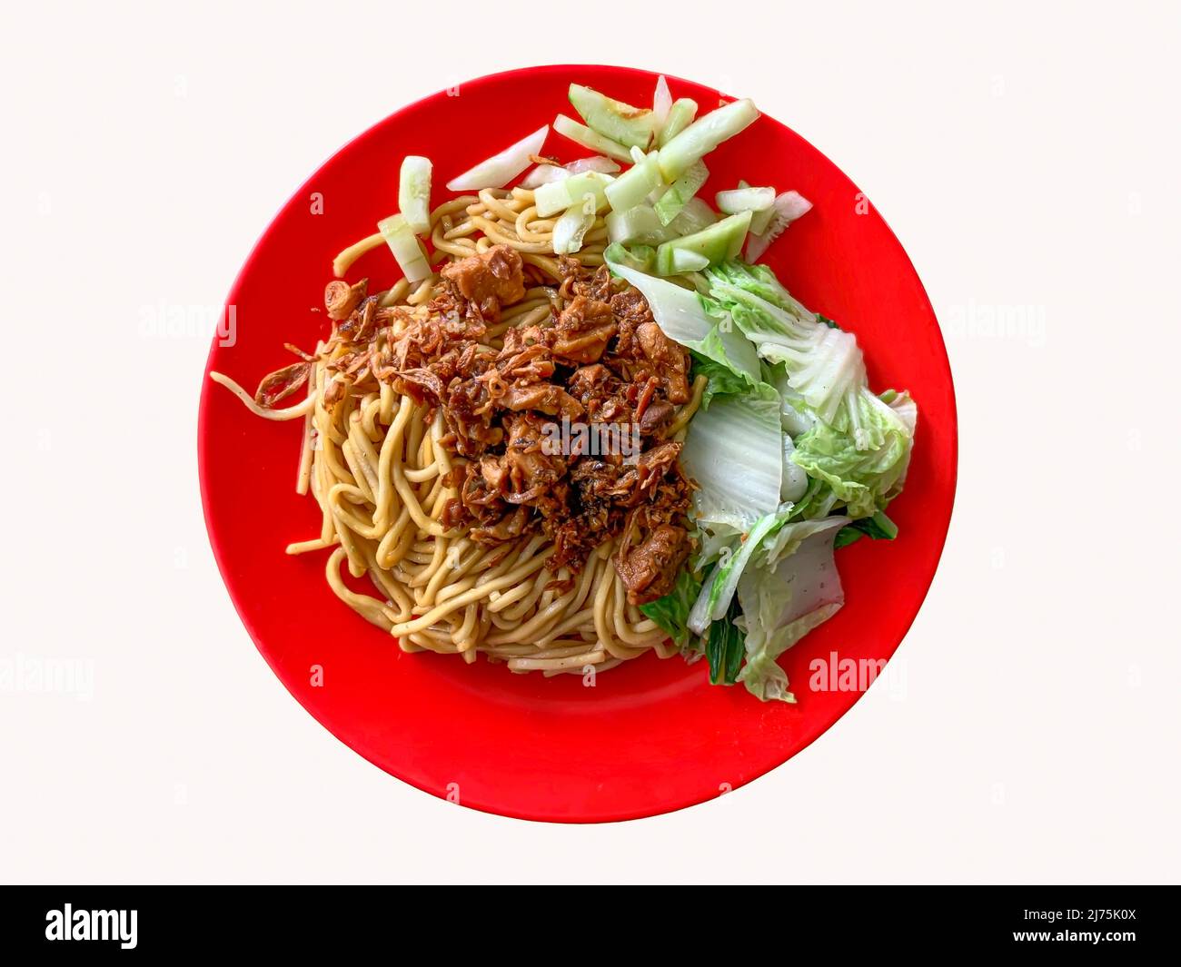 Mie Goreng Or Fried Noodles Served With Chicken And Vegetables On A mie-goreng-or-fried-noodles-served-with-chicken-and-vegetables-on-a