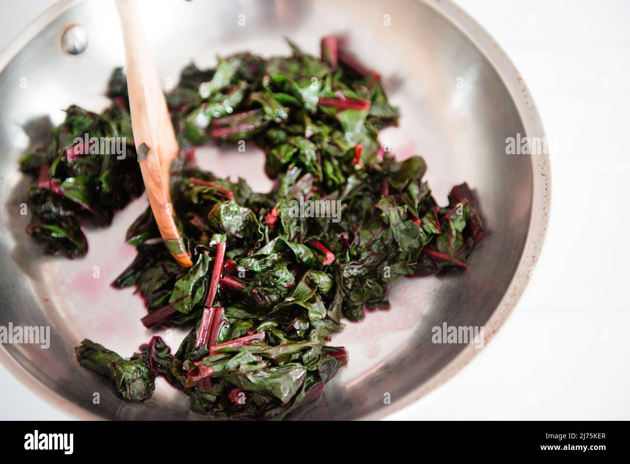 Red Swiss chard cooking in a stainless steel pan Stock Photo - Alamy
