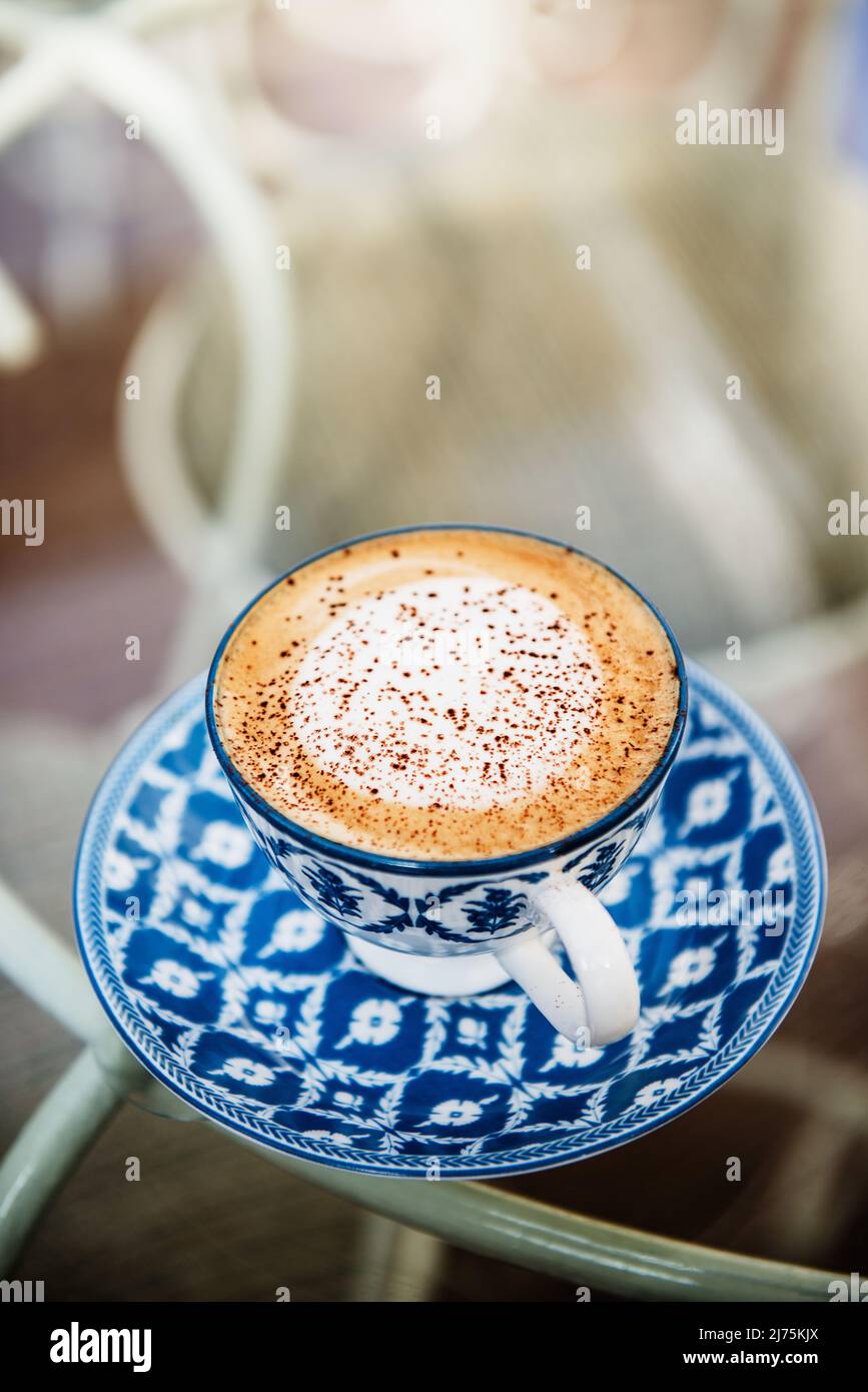 Cappuccino dusted with cocoa powder Stock Photo - Alamy
