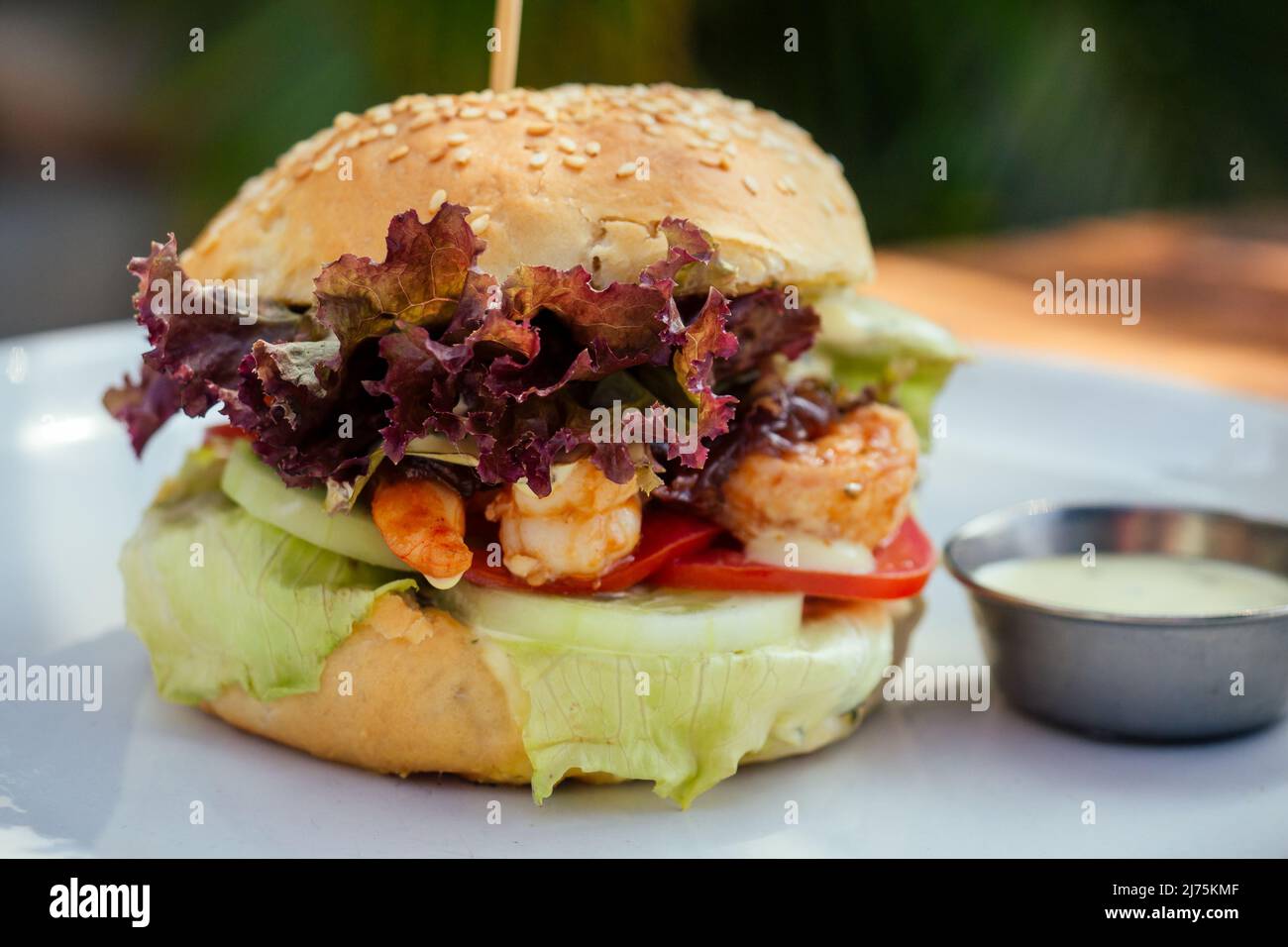 prawns burger and french fry on table tropical sea ,palms tree and ...