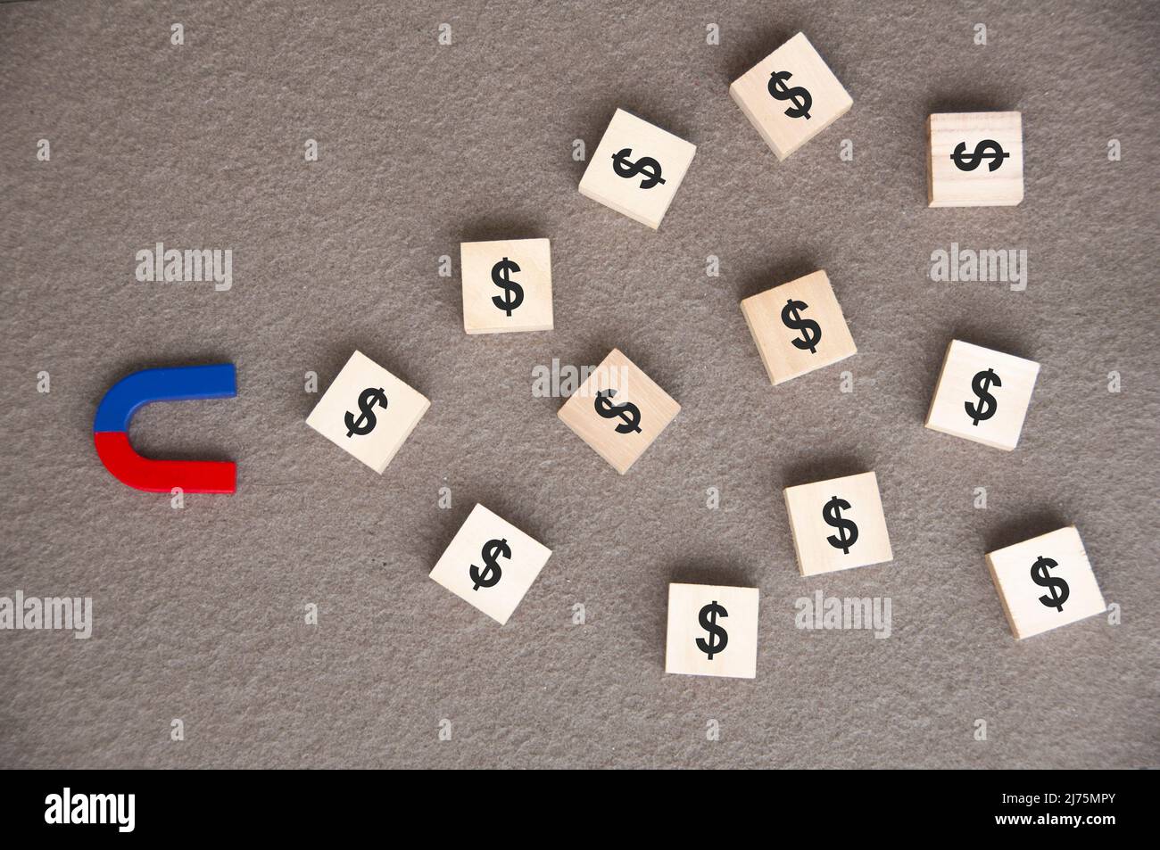 Business concept. Magnet attracting money with marble background Stock ...