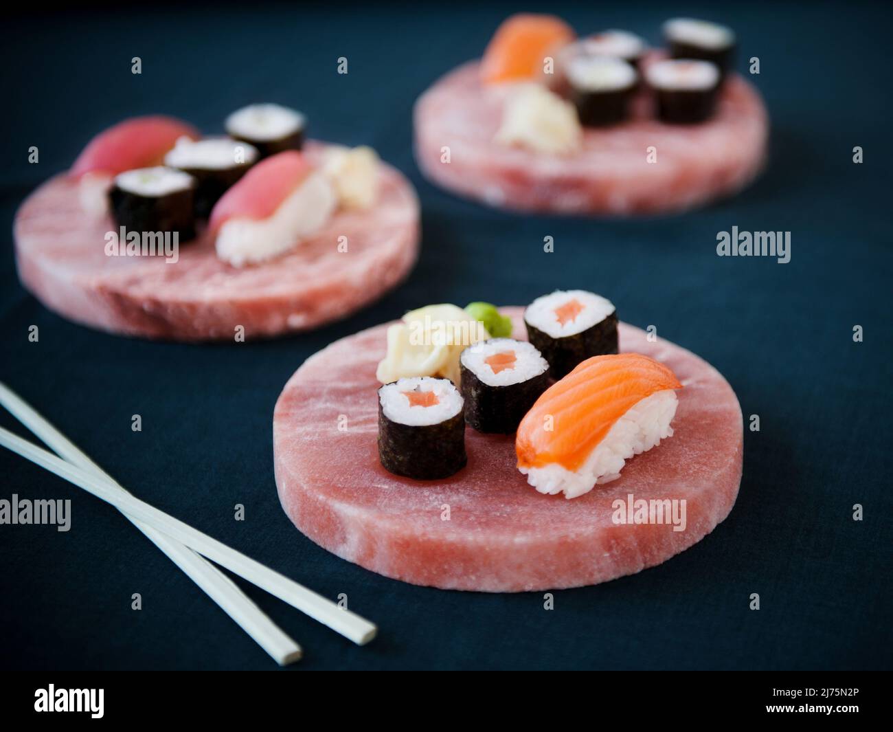 Sushi on Pink Himalayan Salt Plates Stock Photo - Alamy