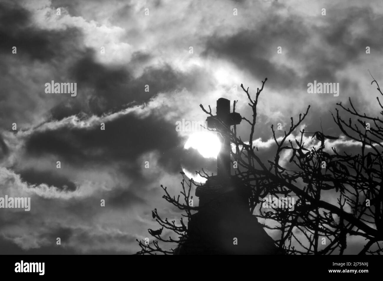 The silhouette of the cross with the sun on the top of Capuchin church ...