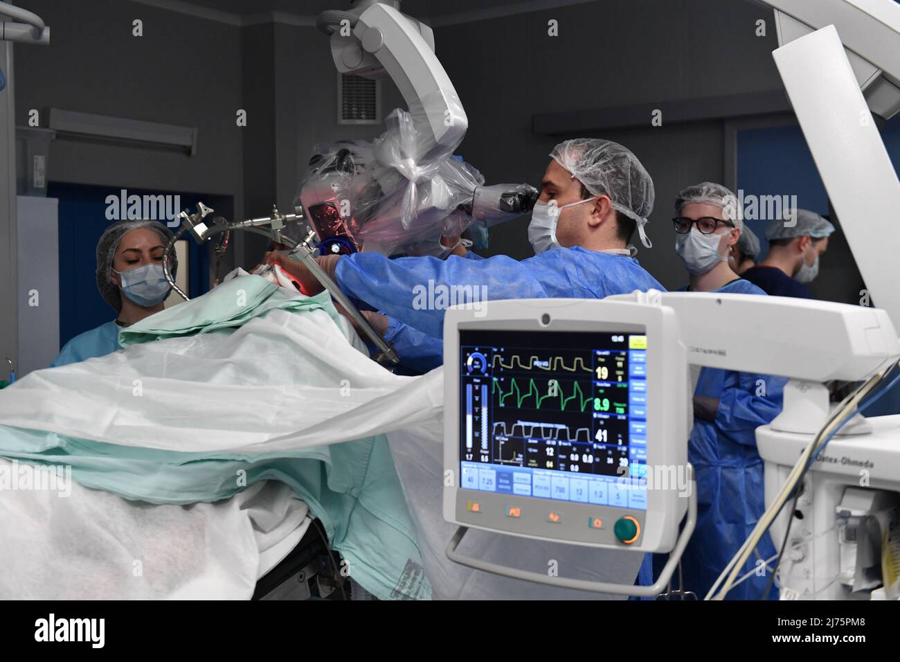 Moscow. Medical employees and the patient in the operating room of the ...