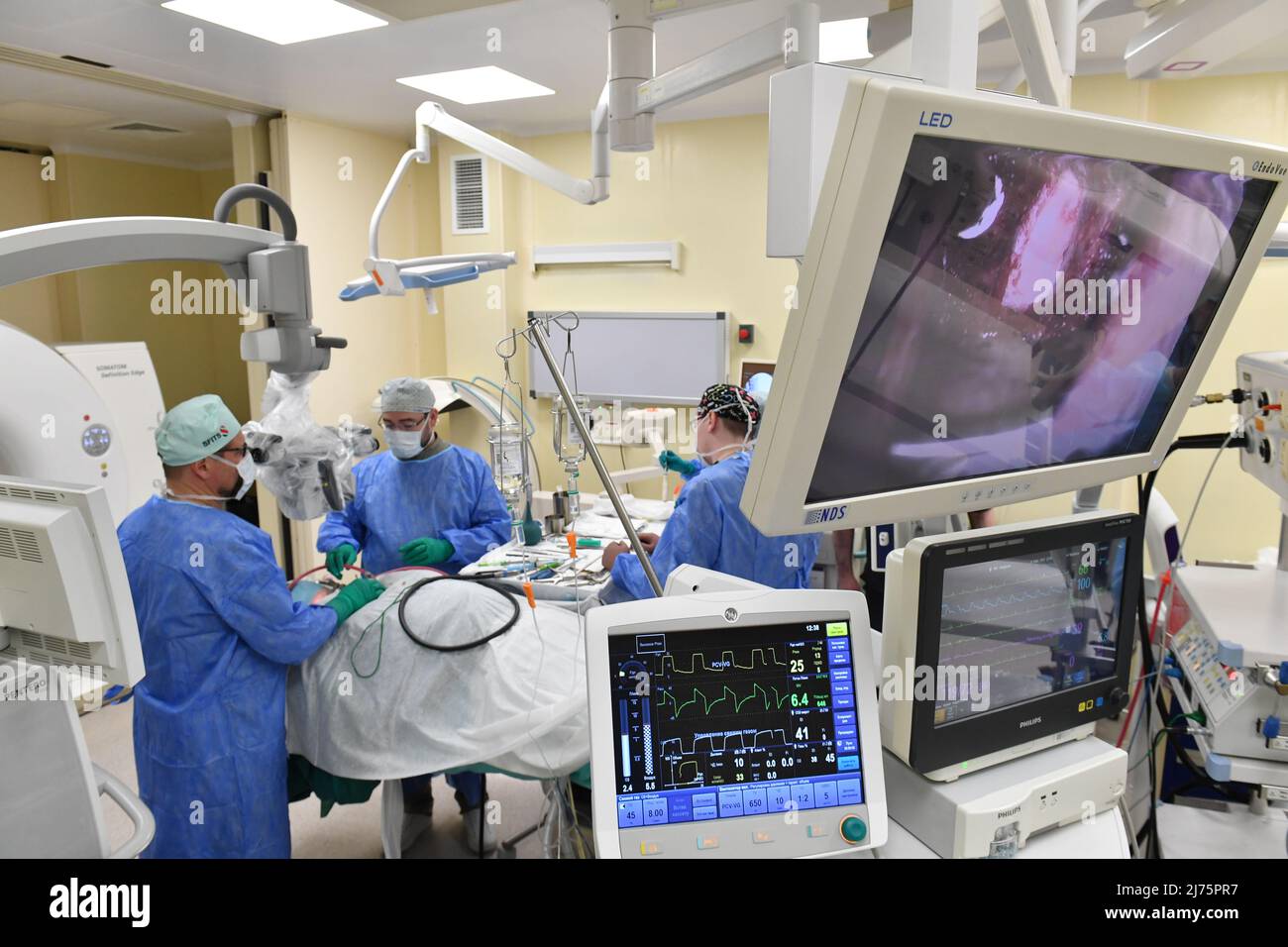 Moscow. Medical employees and the patient in the operating room of the ...