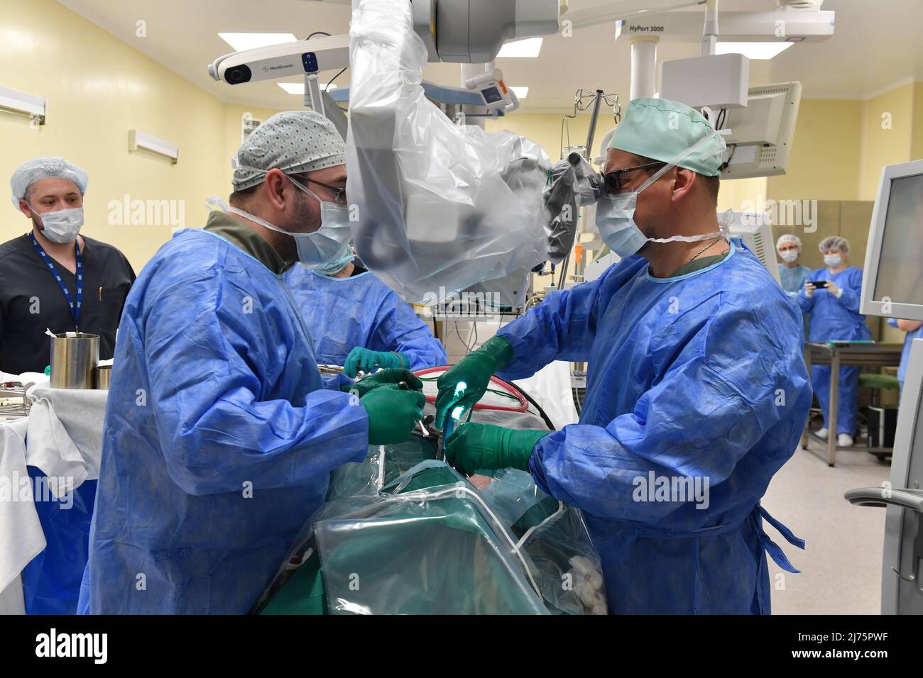 Moscow. Medical employees and the patient in the operating room of the ...