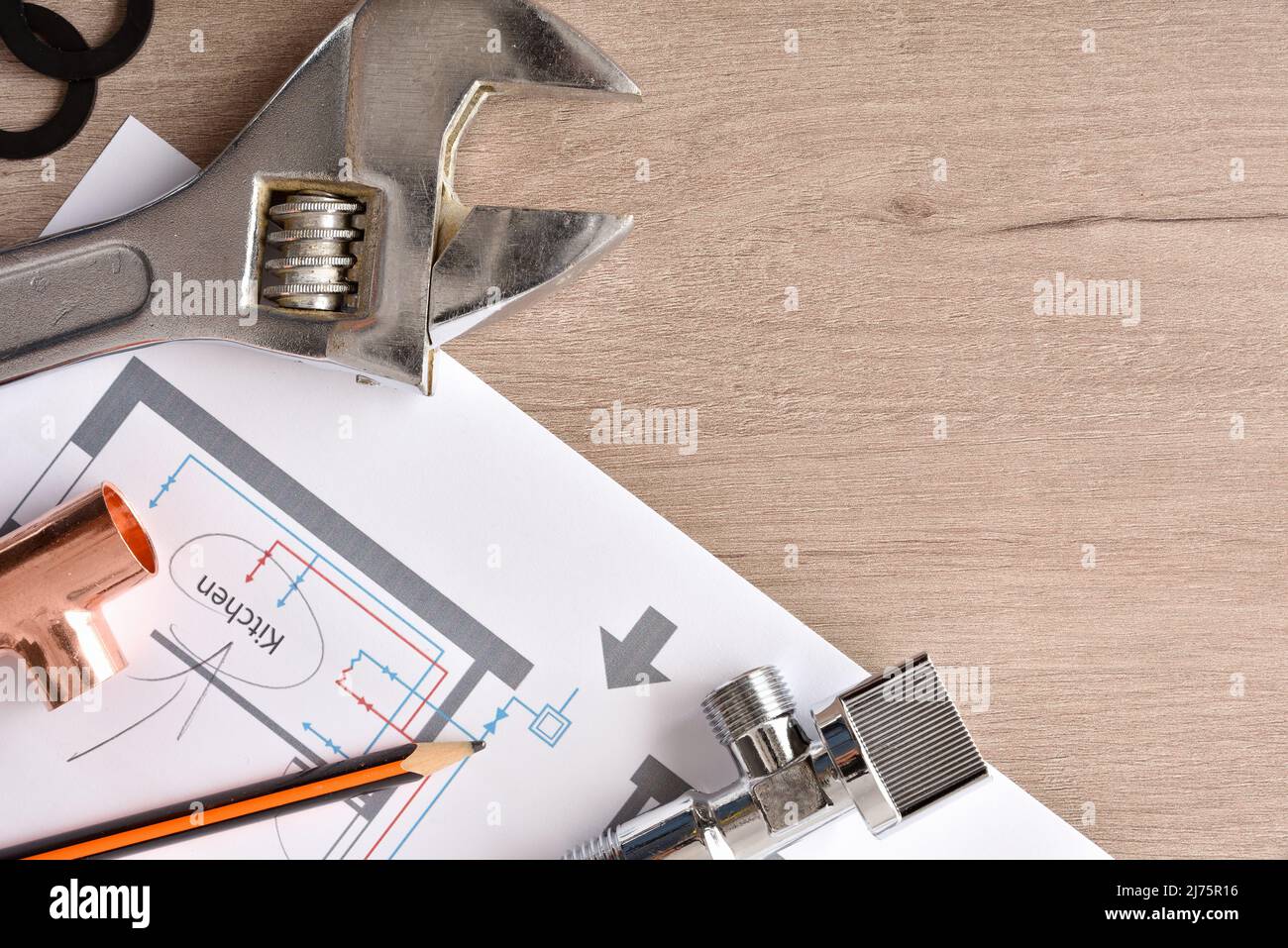 Concept of water installation with plans and housing material on wooden ...