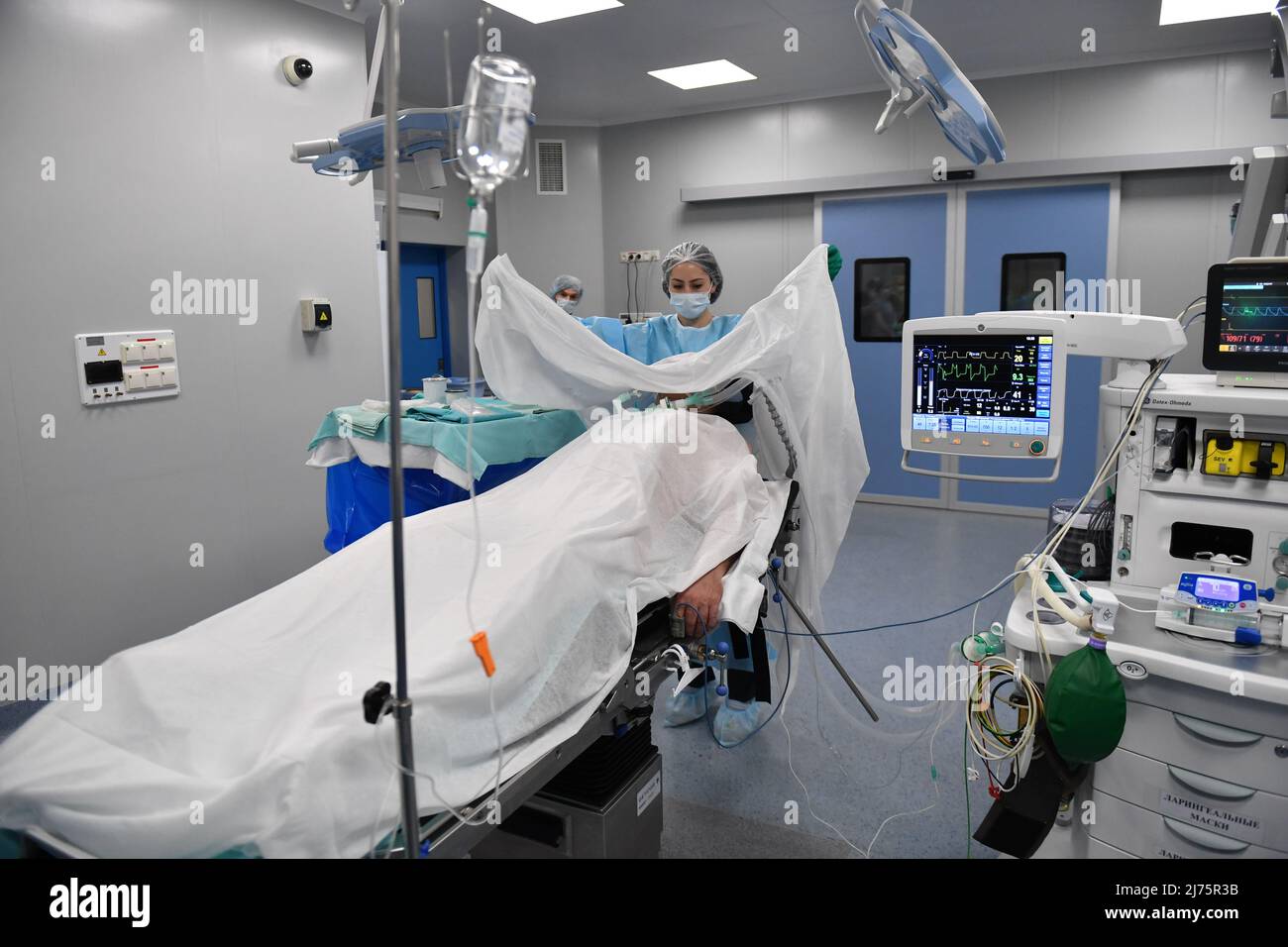 Moscow. Medical employees and the patient in the operating room of the ...