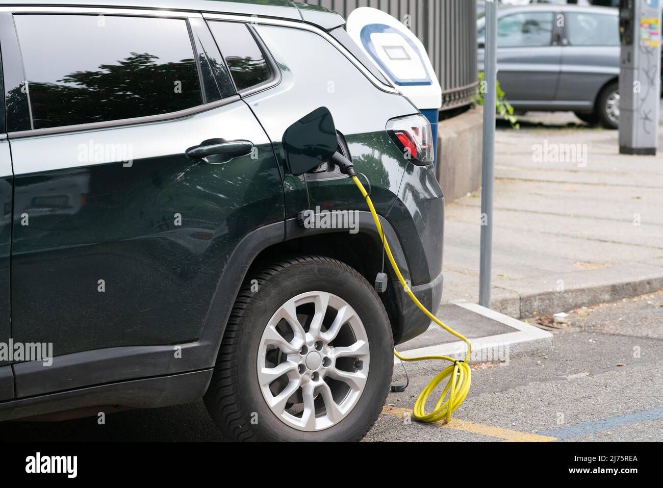 electric car: the plug-in with cable carries the electric power so that ...