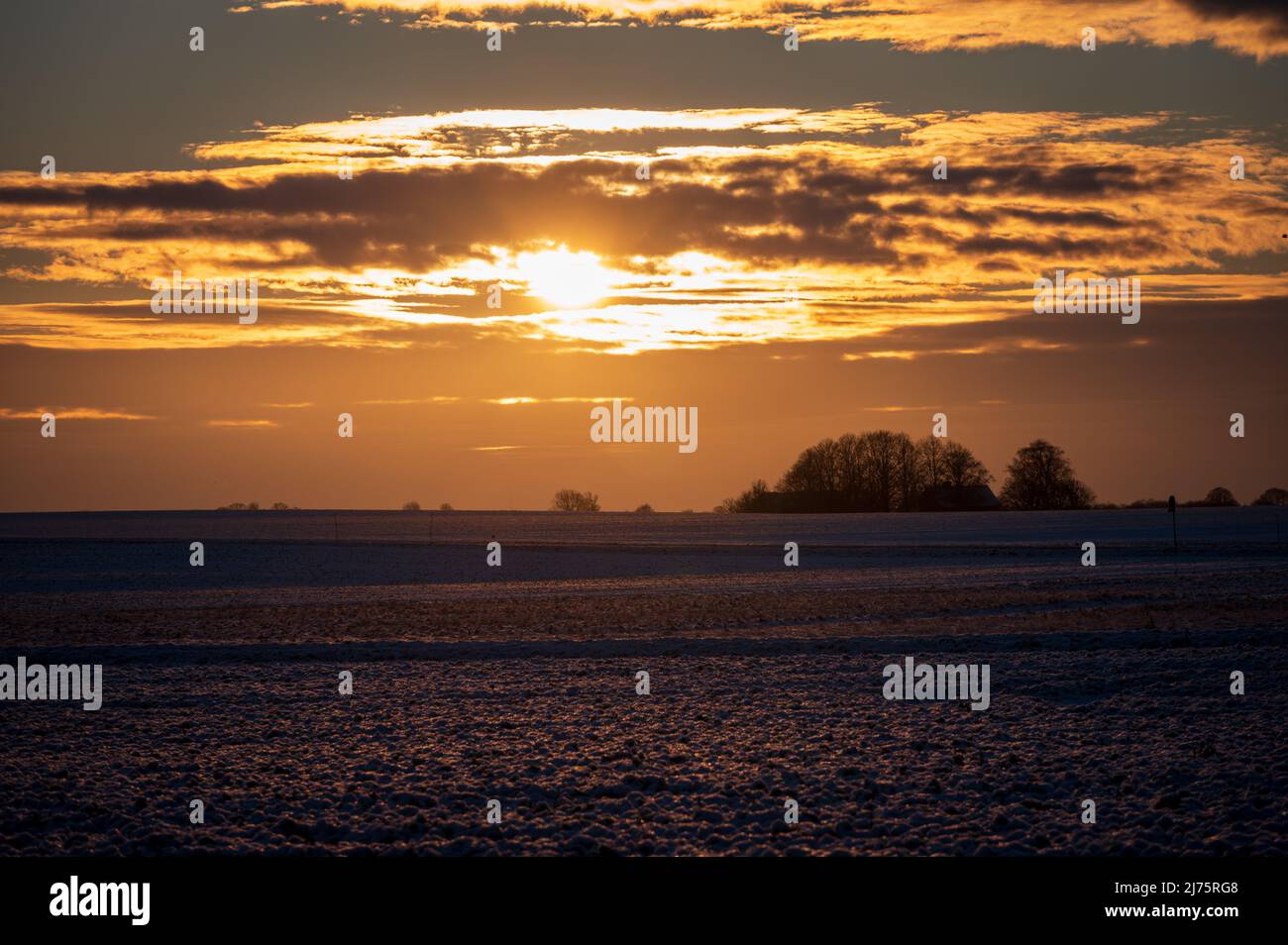 Cloudy winter sunset above rural farm fields in Skåne Sweden Stock Photo - Alamy
