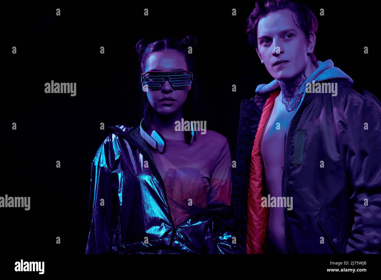 Cyber security agents in ultramodern outfits standing against black ...