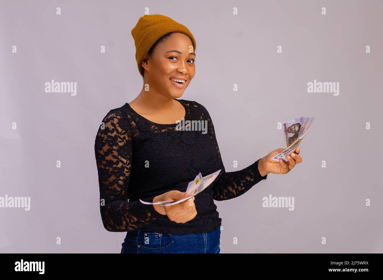 lady isolated over white background holding money and giving out money ...