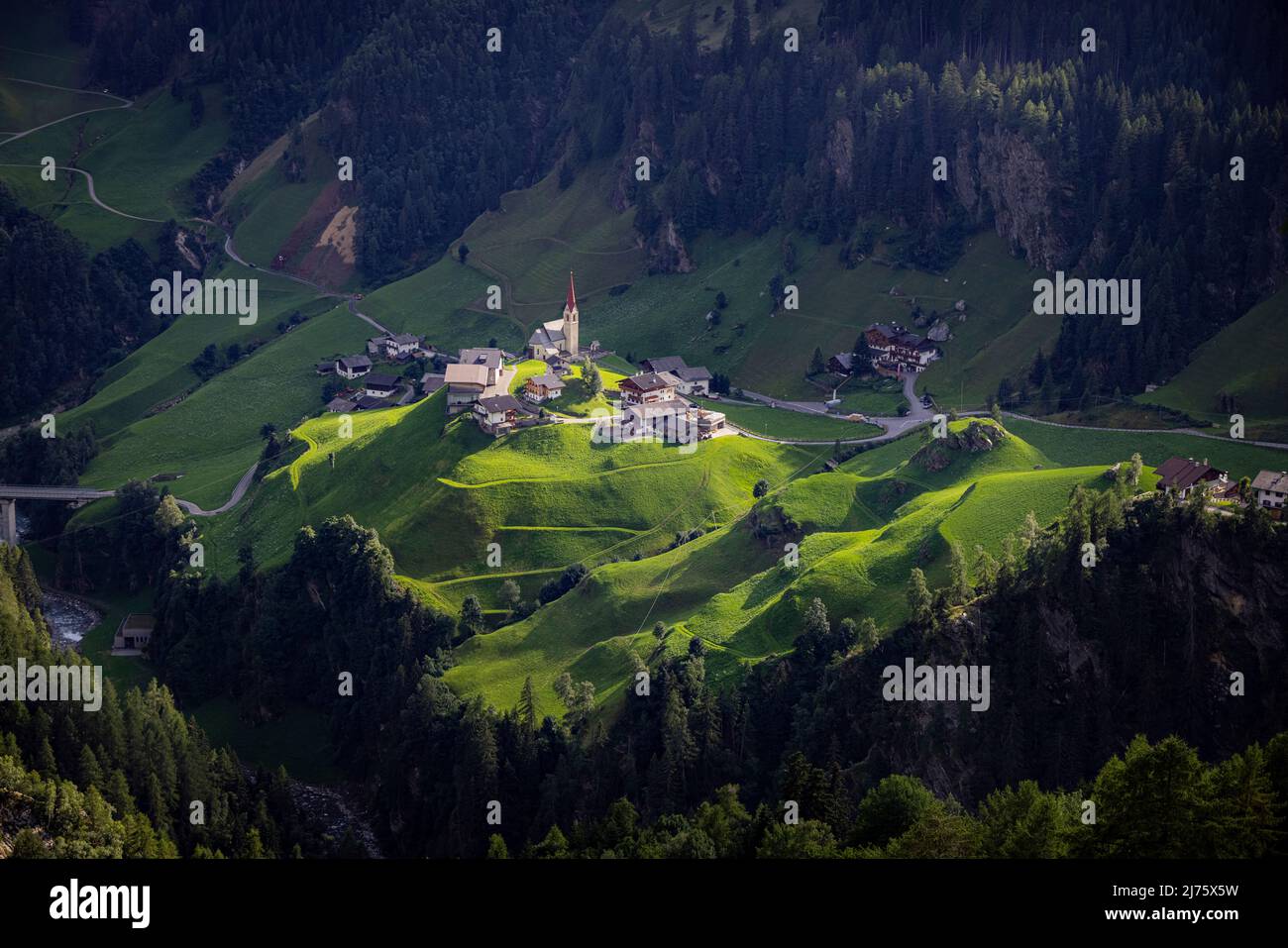 Romantic small village with chapel in the South Tyrolean Alps in Italy ...