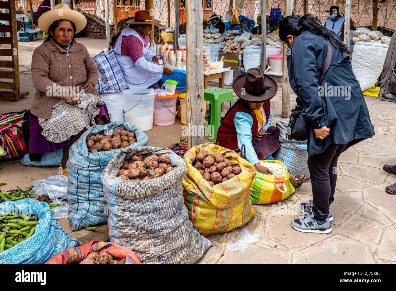 Indigenous Quechua Women Selling Potatoes At The Famous Sunday Market ...
