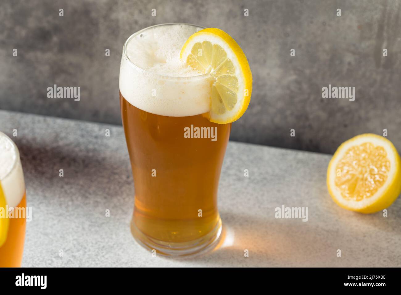 Cold Boozy Refreshing Lemon Beer Shandy Ready to Drink Stock Photo - Alamy