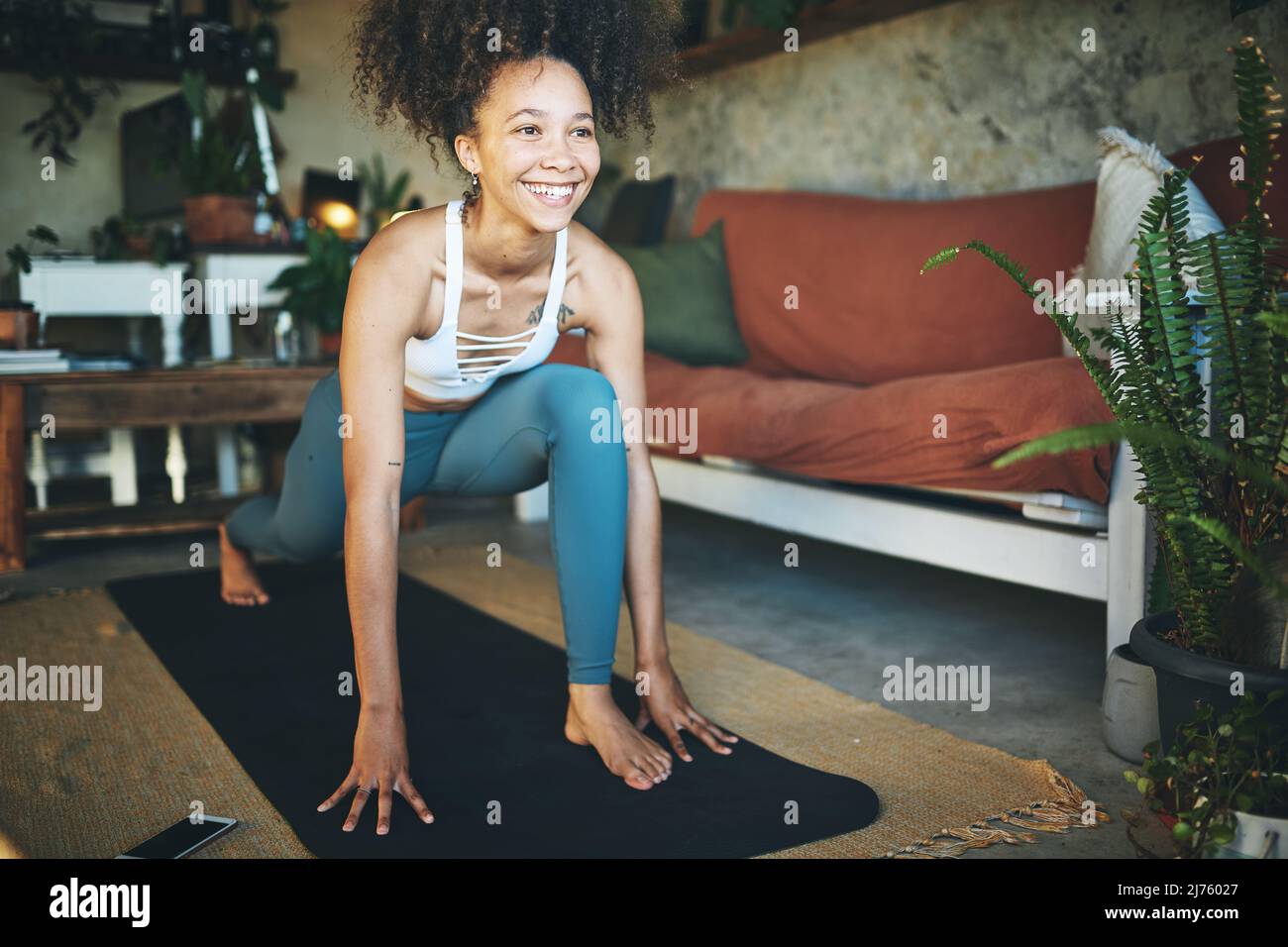 Improving her flexibility and strength with every stretch Stock Photo ...
