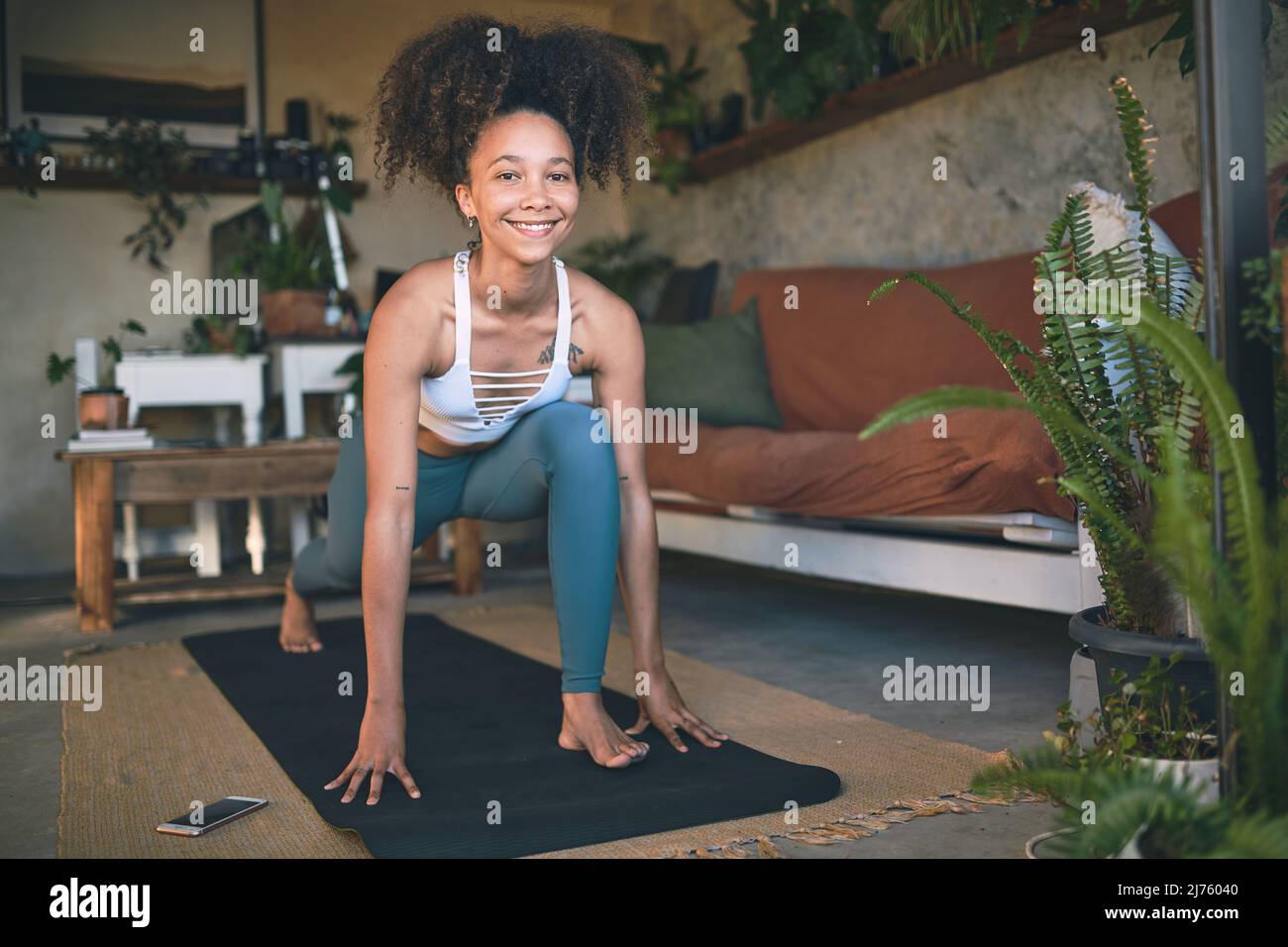 Improving her flexibility and strength with every stretch Stock Photo ...