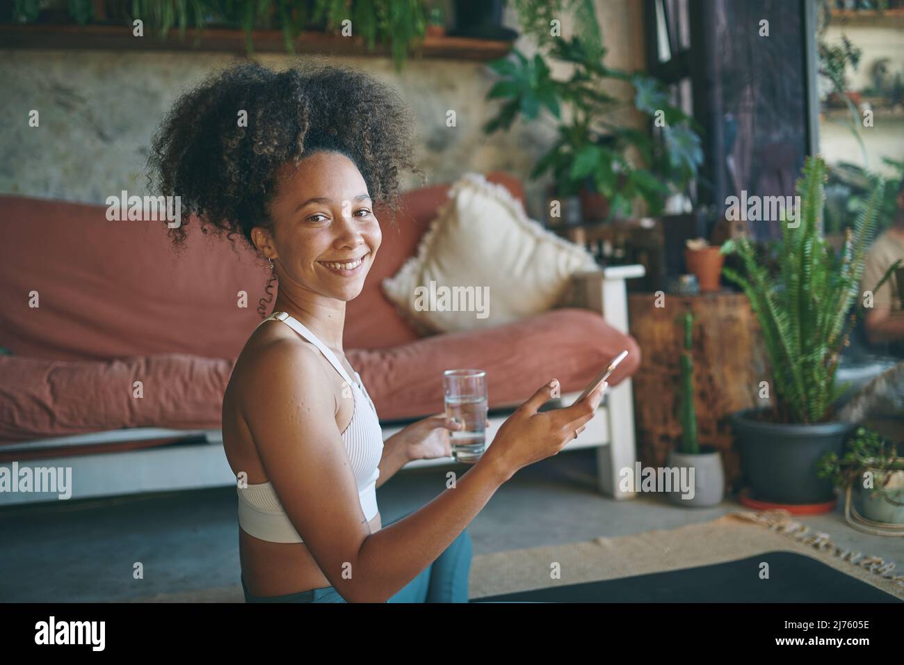 Young girl smiling at the camera Stock Photo - Alamy