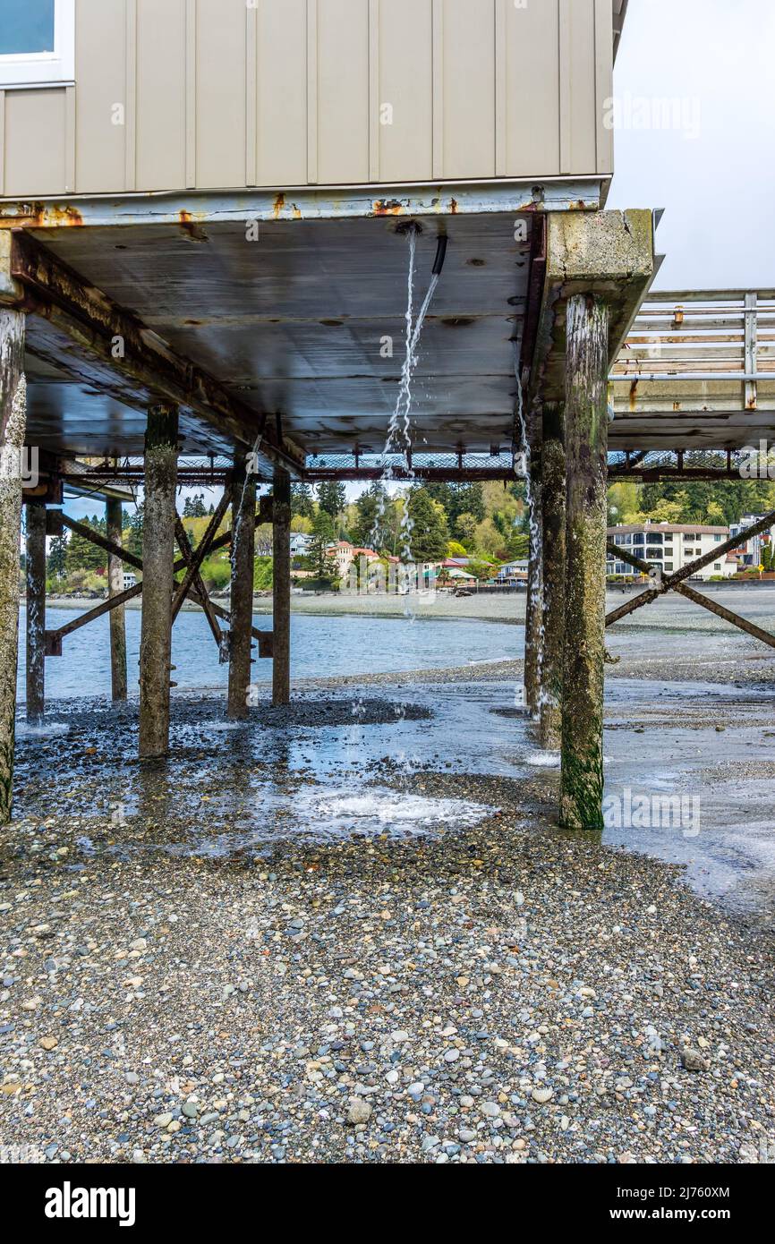 Excess water flow down from below the pier in Redondo Beach, Washington ...