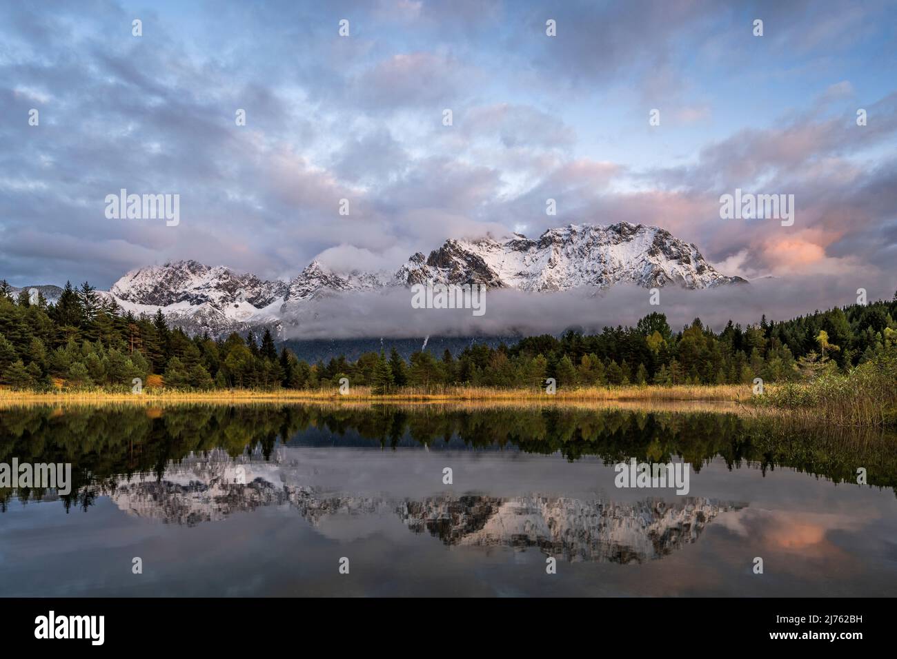 Lake reflection atmospheric conditions alps hi-res stock photography ...