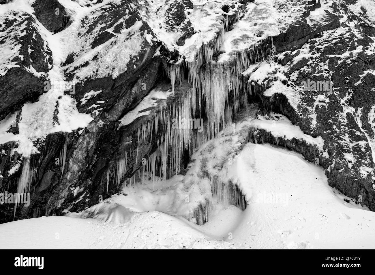 Icicles on rock face in winter in the karwendel mountains hi-res stock ...