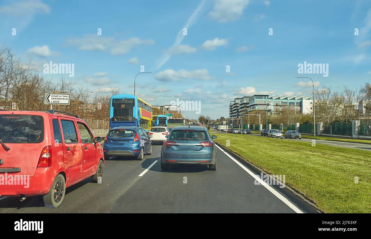 Rear view of cars driving on motorway, Ireland. Road with metal safety ...