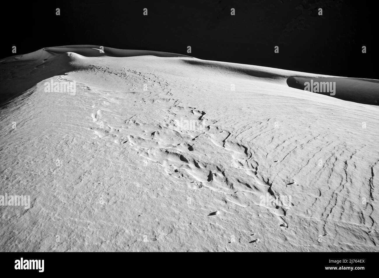 Snow forms on the Karwendel, in the background the darkness of the ...