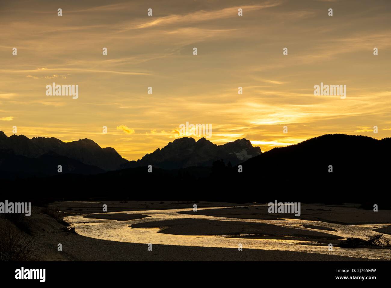 The streambed of the Isar near Wallgau reflects the colors of the ...