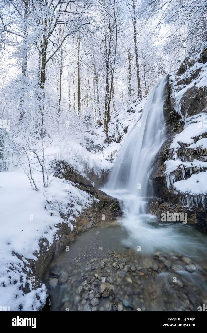 The waterfall at the Kesselberg, Kesselbergfall in winter with snow and ...