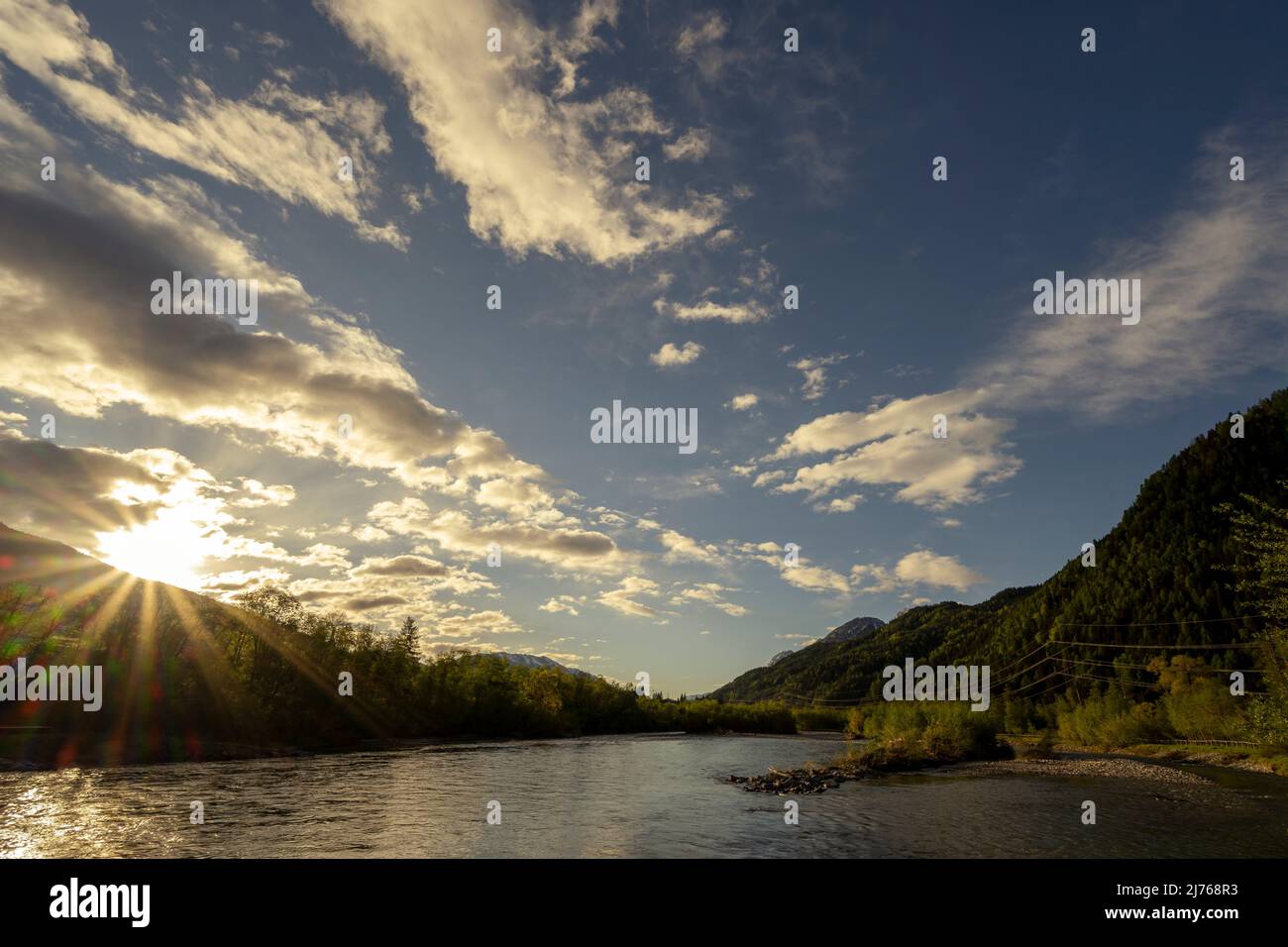 Sunrise with sun star at the river Isel near Lienz in East Tyrol Stock ...