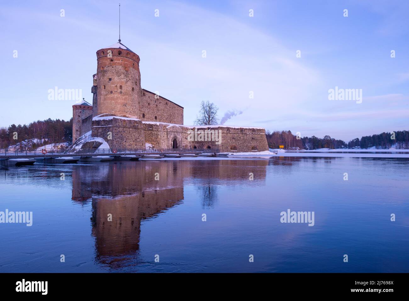 Ancient fortress of Olavinlinna (Olafsborg) in the March evening ...